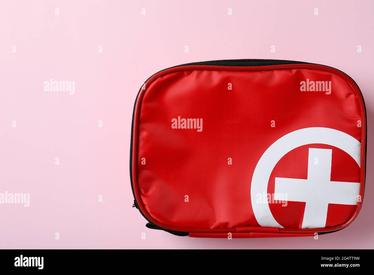 First aid medical kit on pink background Stock Photo - Alamy