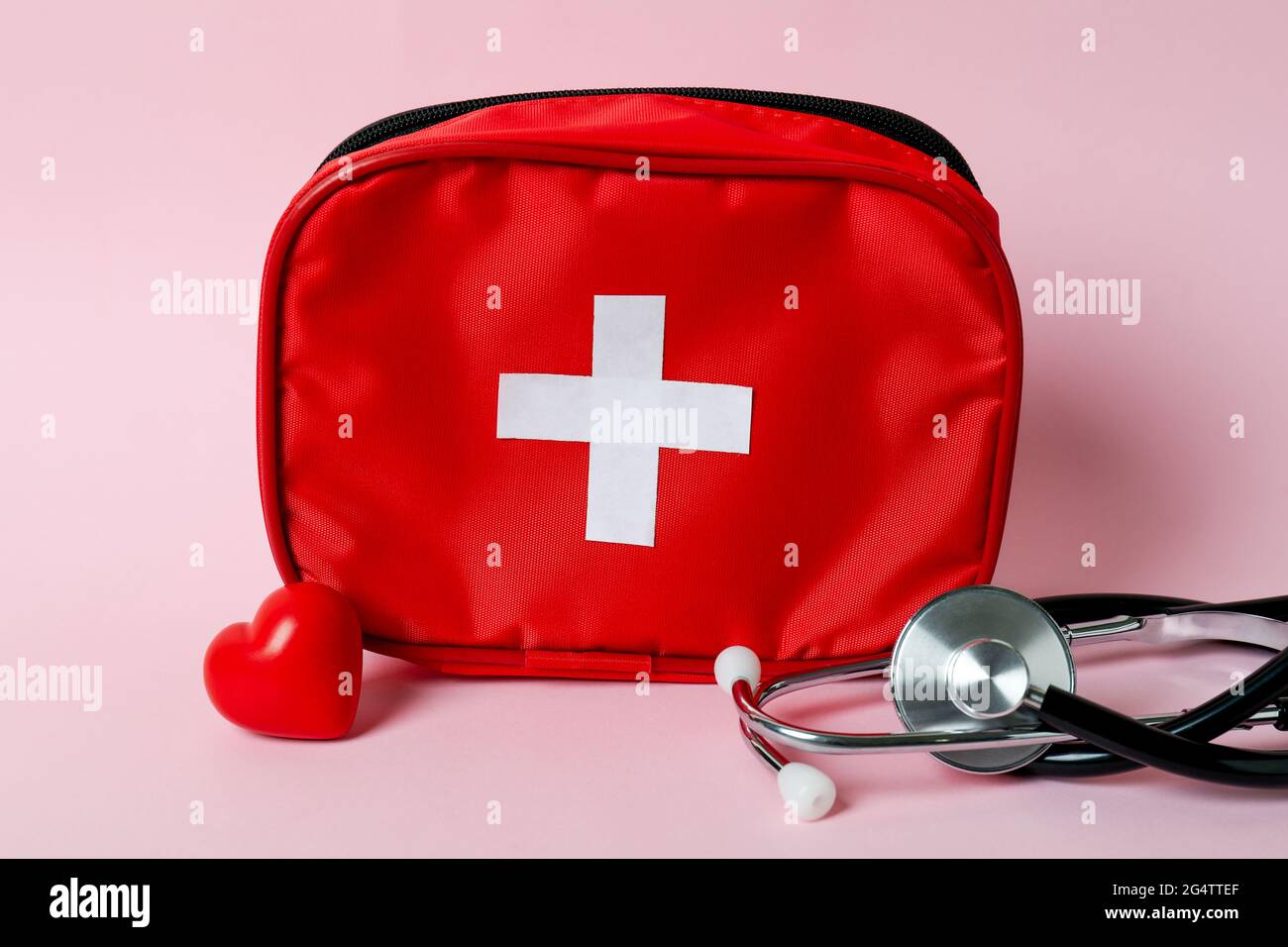 First aid medical kit on pink background Stock Photo - Alamy