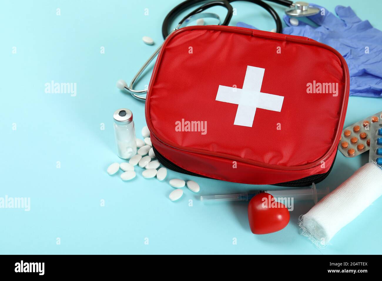 First aid medical kit on blue background Stock Photo - Alamy