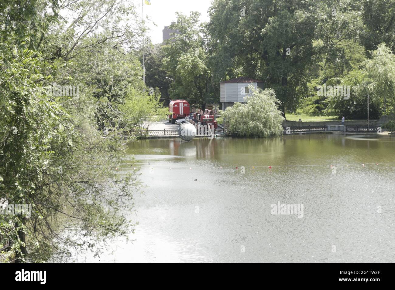 Public park drenched in rain. Water logged park.Wet benches. Park ...