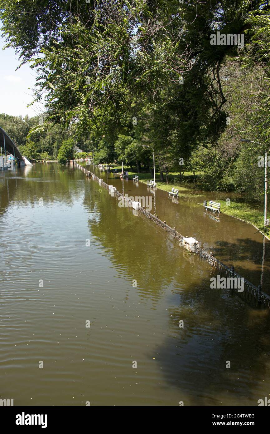 Public park drenched in rain. Water logged park.Wet benches. Park ...
