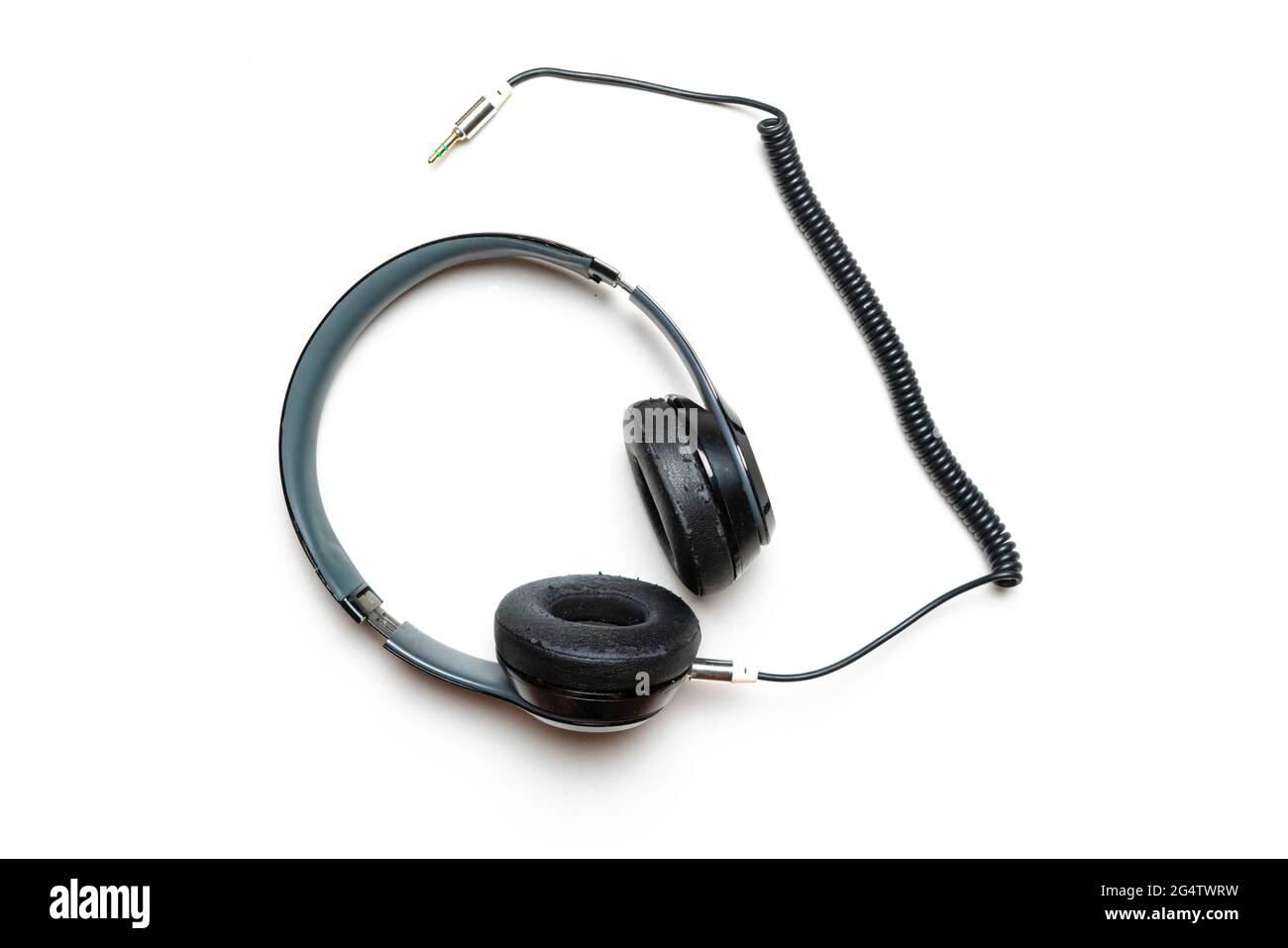 old used headphones isolated on white background Stock Photo - Alamy