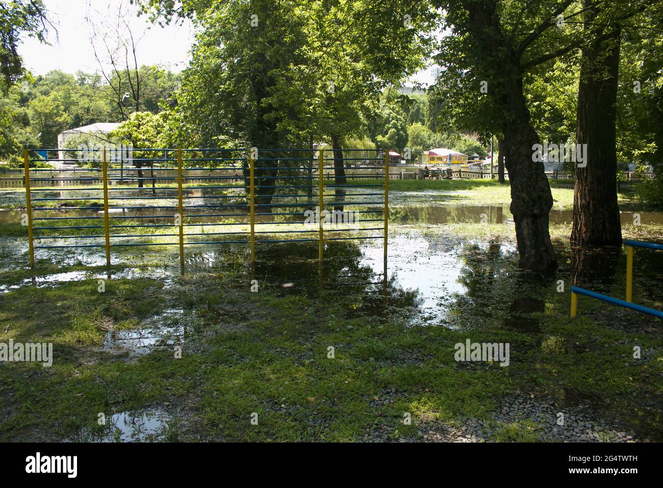 Public park drenched in rain. Water logged park.Wet benches. Park ...