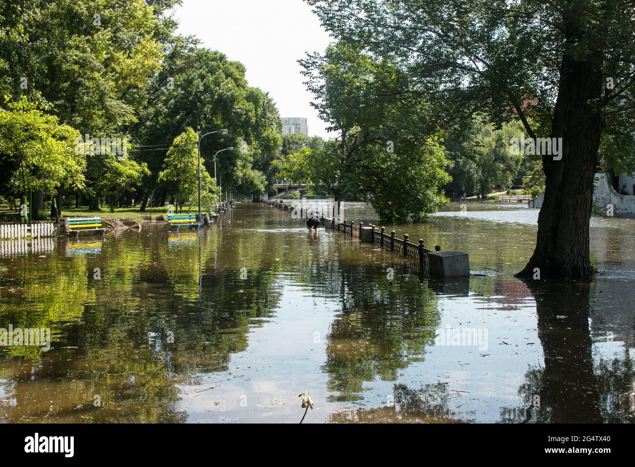 Public park drenched in rain. Water logged park.Wet benches. Park ...