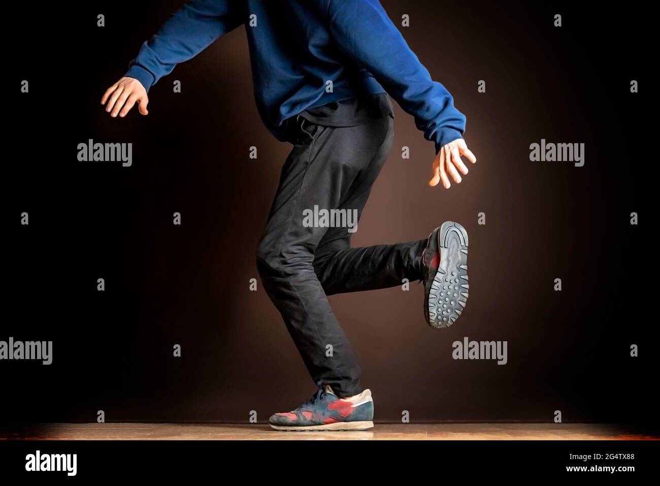 male dancer perform skills in dark studio Stock Photo - Alamy