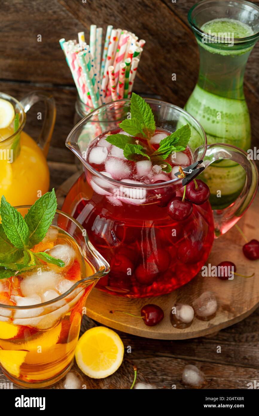 Ice cold beverages with fresh fruits in glass pitchers Stock Photo - Alamy