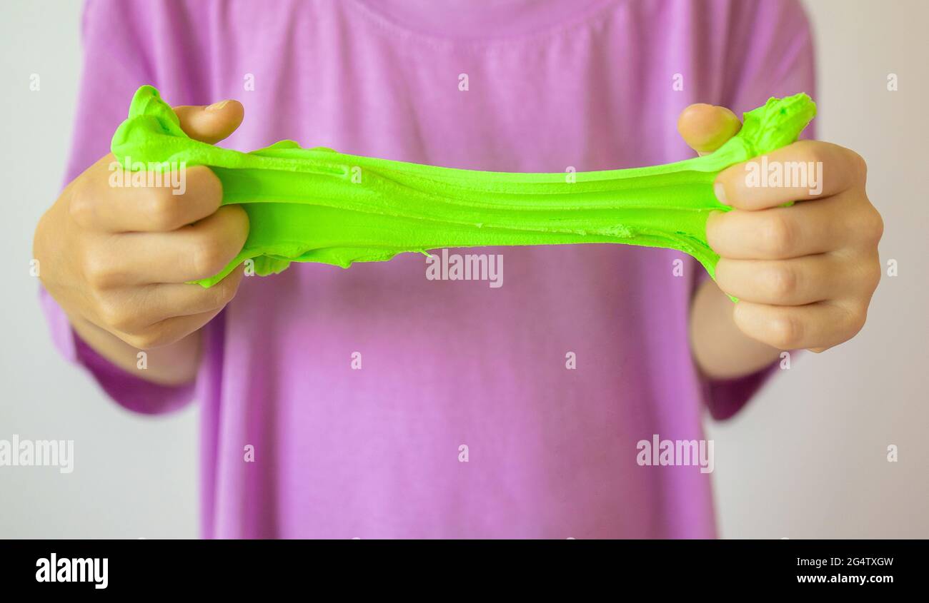 Green slime in hand hi-res stock photography and images - Alamy