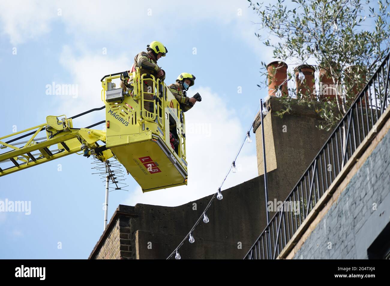 London Fire Brigade (LFB) firefighters at the scene of a fire at the ...