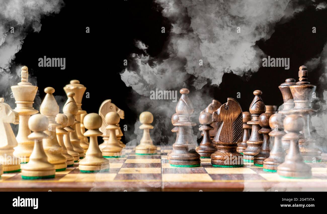 chess board game battle in smoke concept background Stock Photo - Alamy