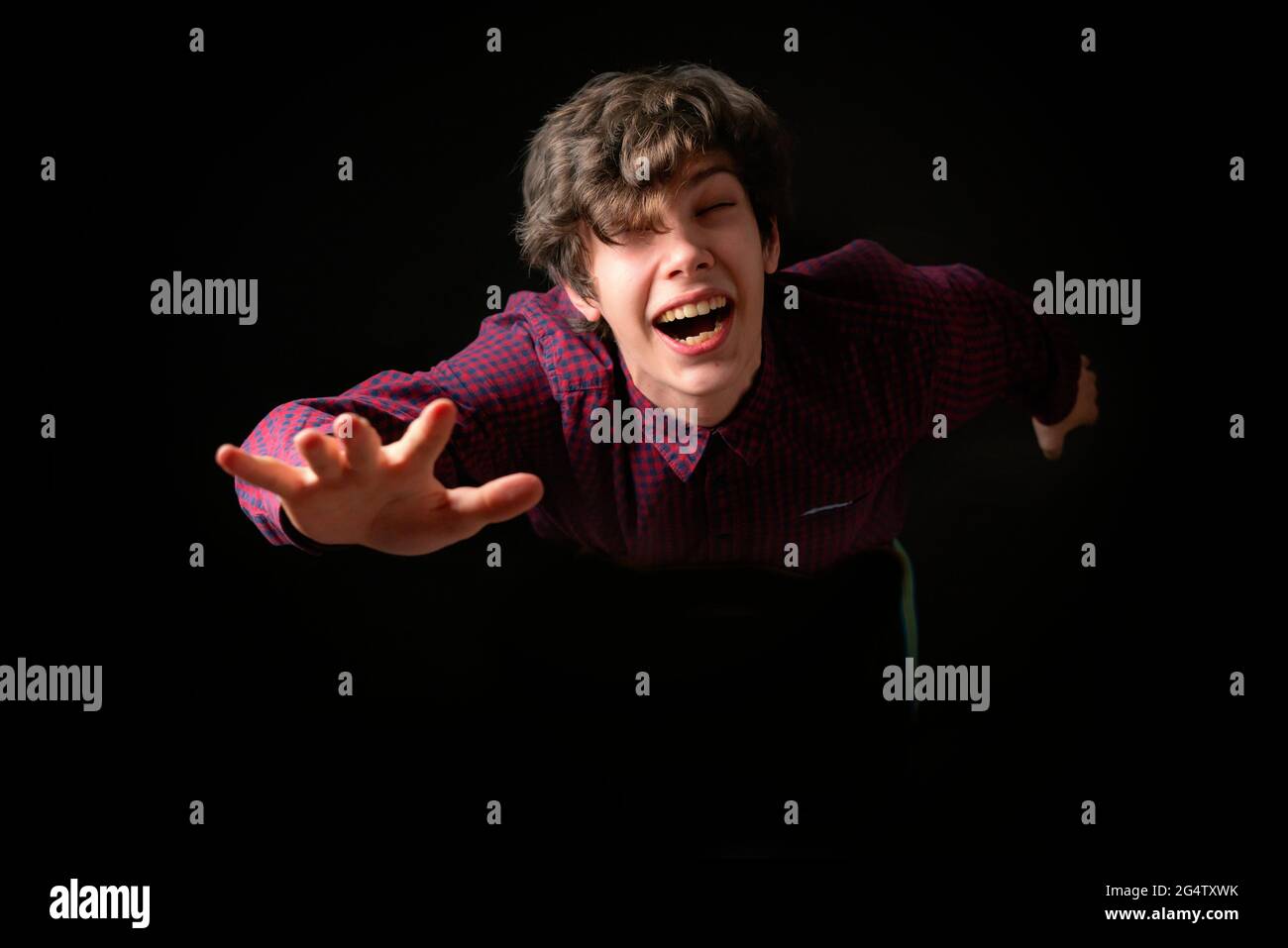 attractive scared male fall down from height on dark background Stock ...