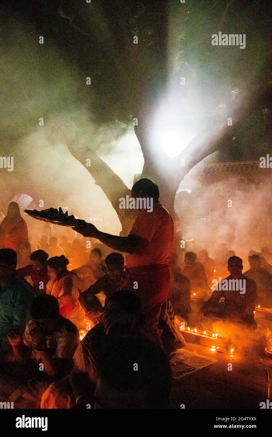 The ritual activity.Thousands of Hindu devotees sits with candle ...