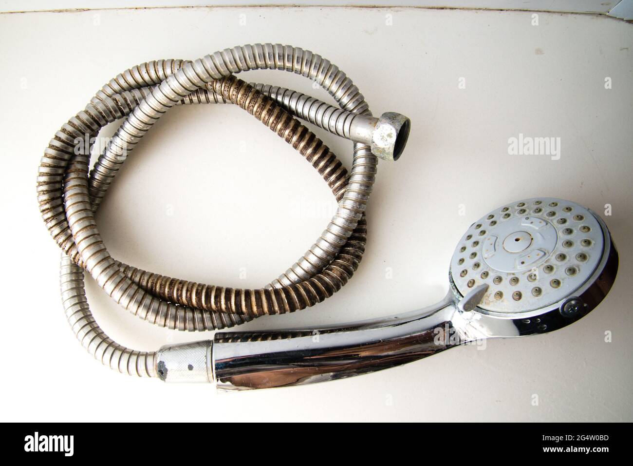 old shower hose, Old plumbing hose pipes Stock Photo - Alamy