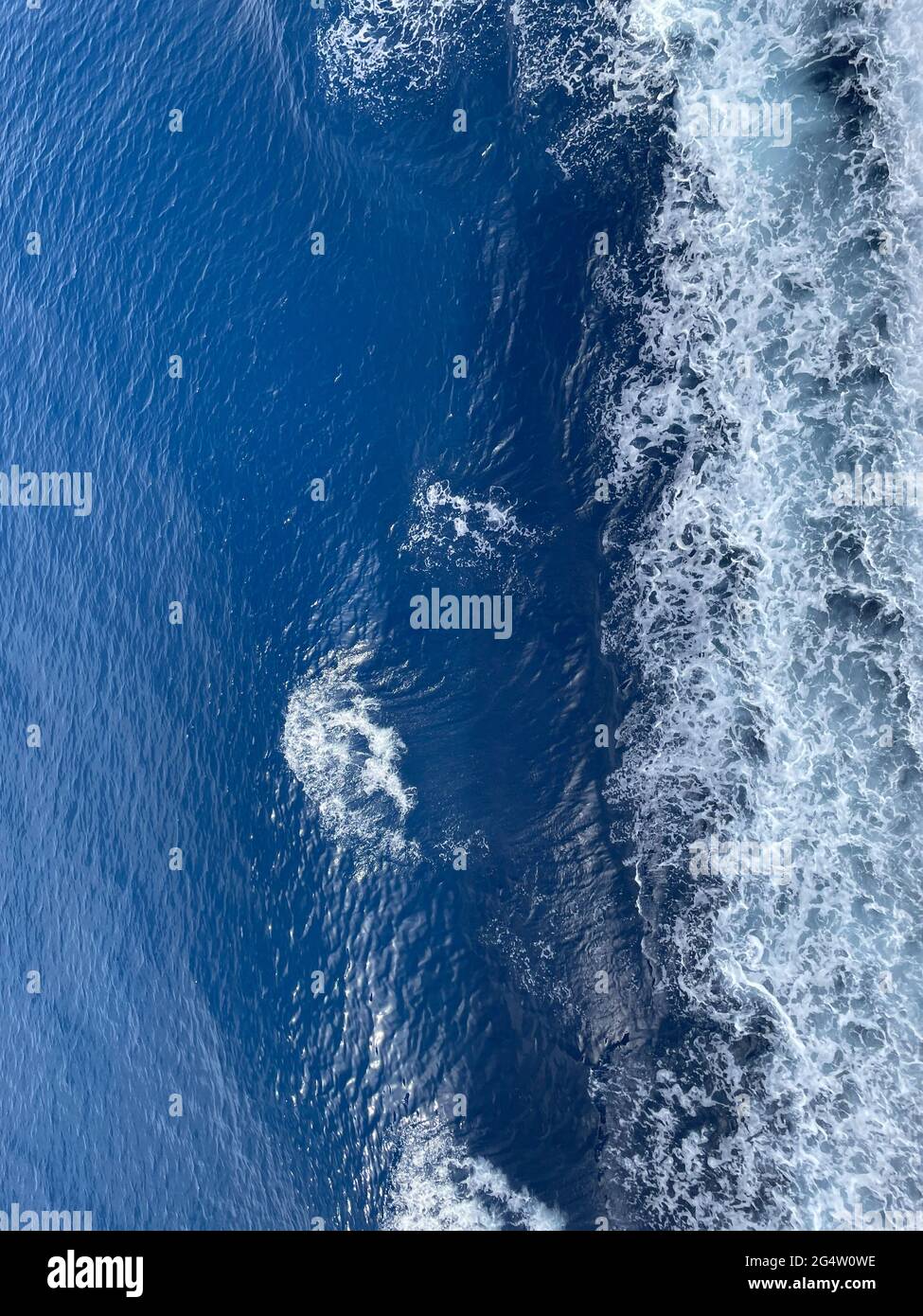 aerial view of blue beach water with frothy waves Stock Photo - Alamy