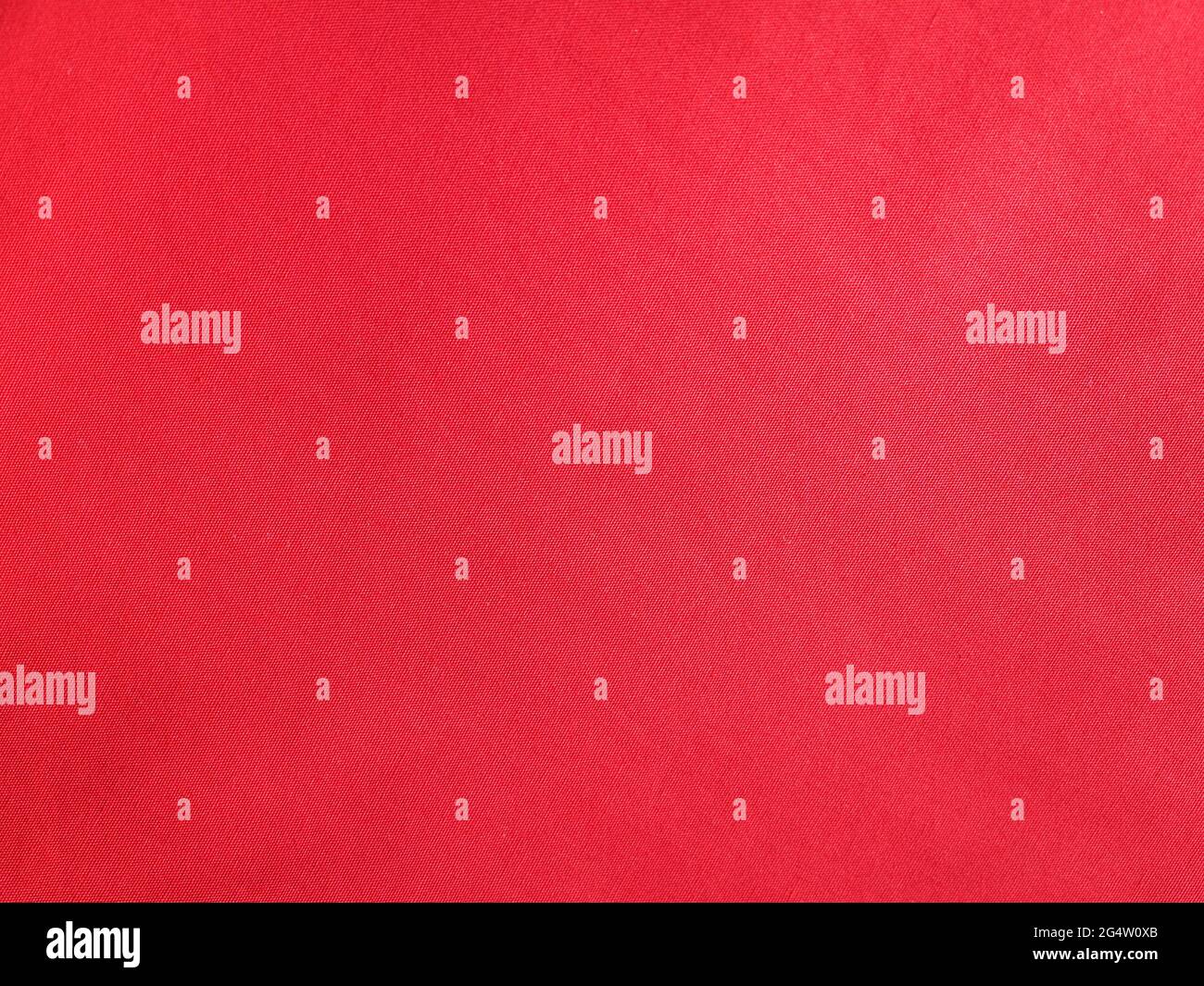 red polyester fabric texture useful as a background Stock Photo - Alamy