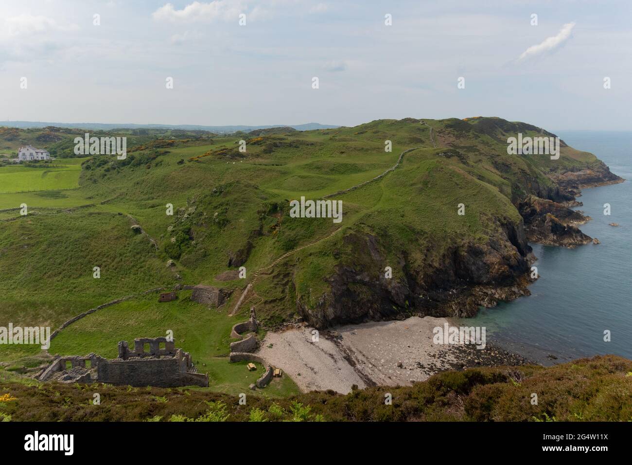 The Isle of Anglesey Coastal path descends steeply to the abandoned ...