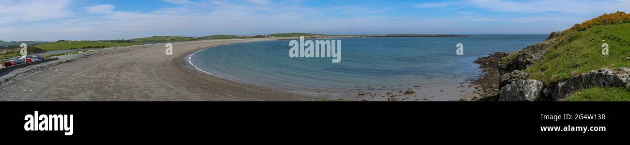 A panoramic view of the shingle beach at Cemlyn Bay on the Isle of ...