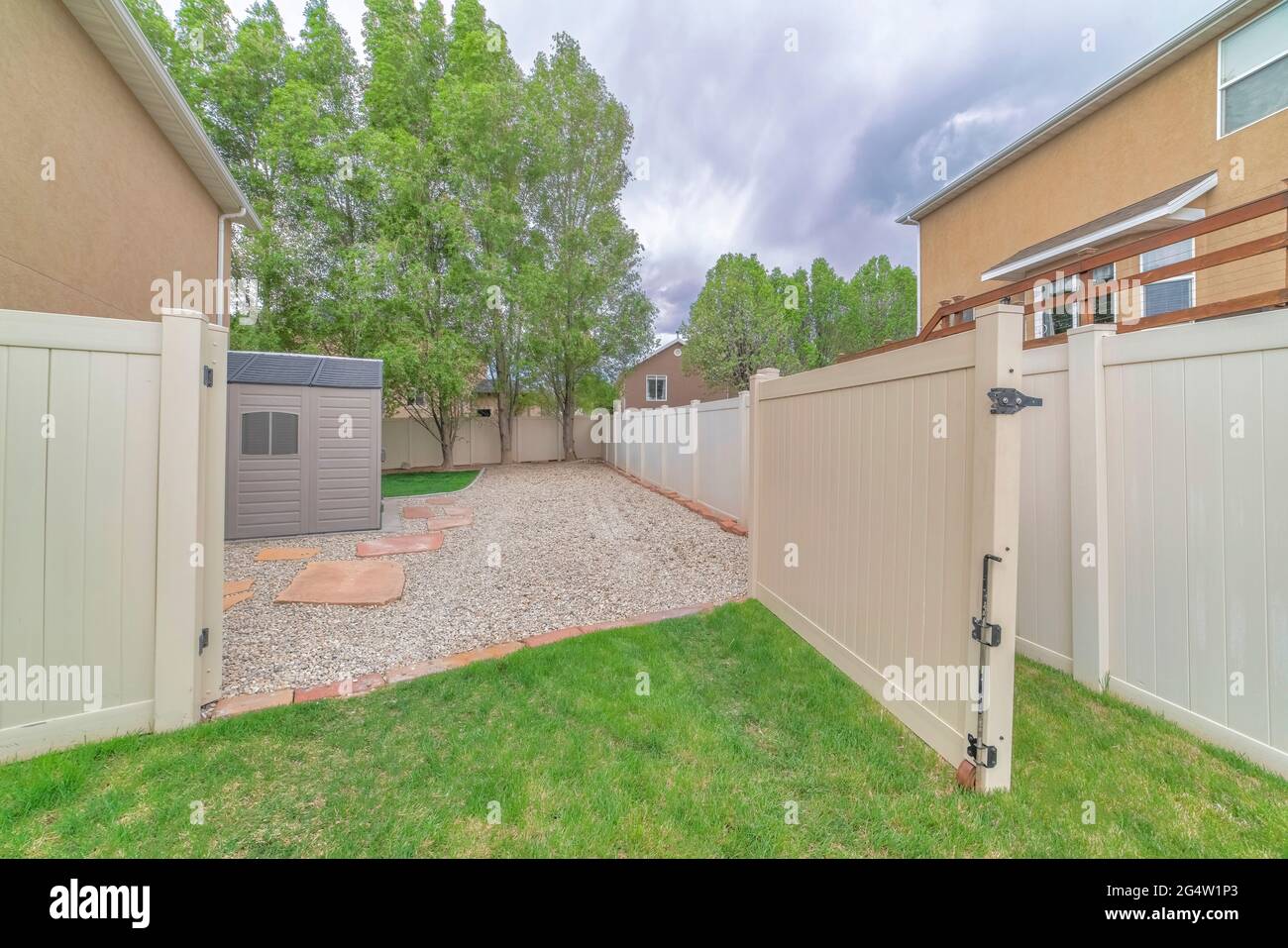 Open wooden gate of a fenced house Stock Photo - Alamy