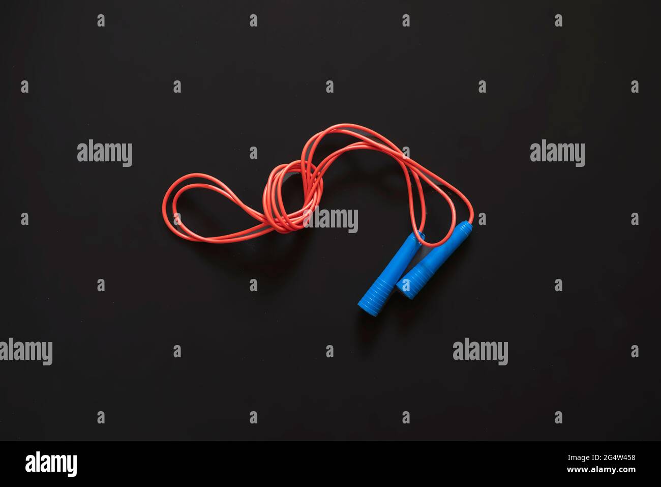 red and blue tied jumping rope isolated Stock Photo - Alamy