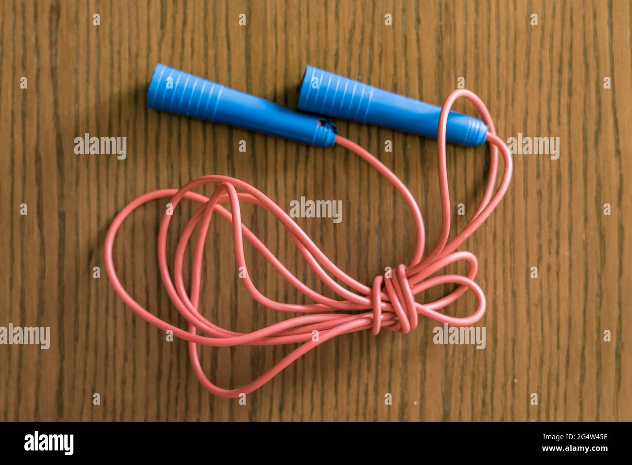 red and blue tied jumping rope isolated Stock Photo - Alamy