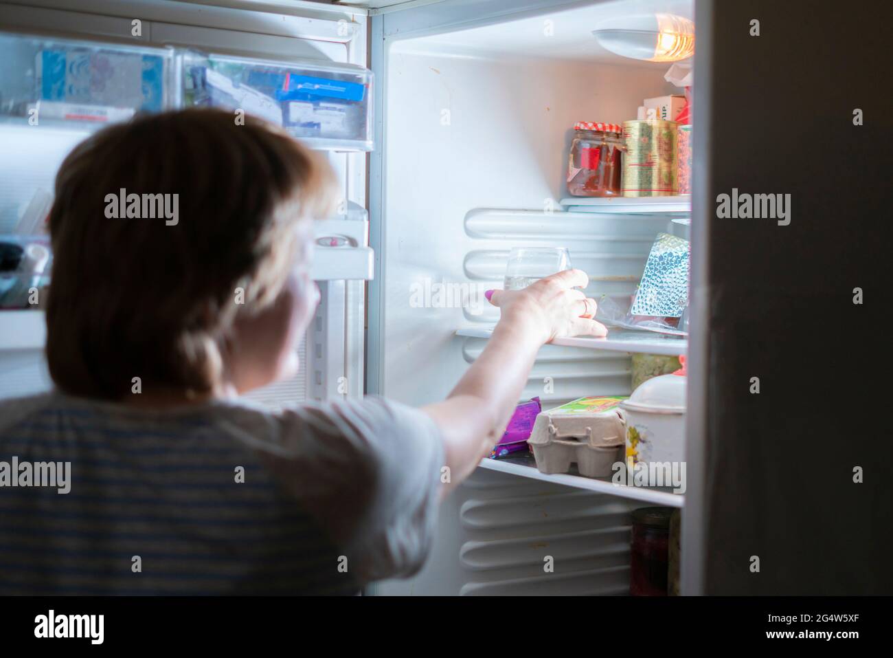 Woman fridge midnight hi-res stock photography and images - Alamy