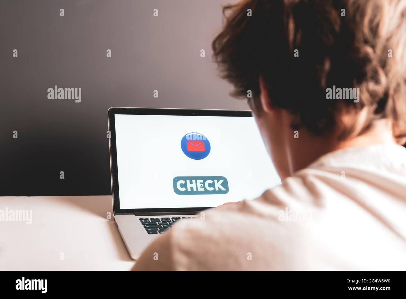 checking male on the laptop Stock Photo - Alamy