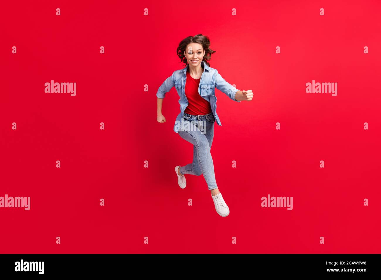 Full length body size photo of cheerful girl jumping up running fast ...