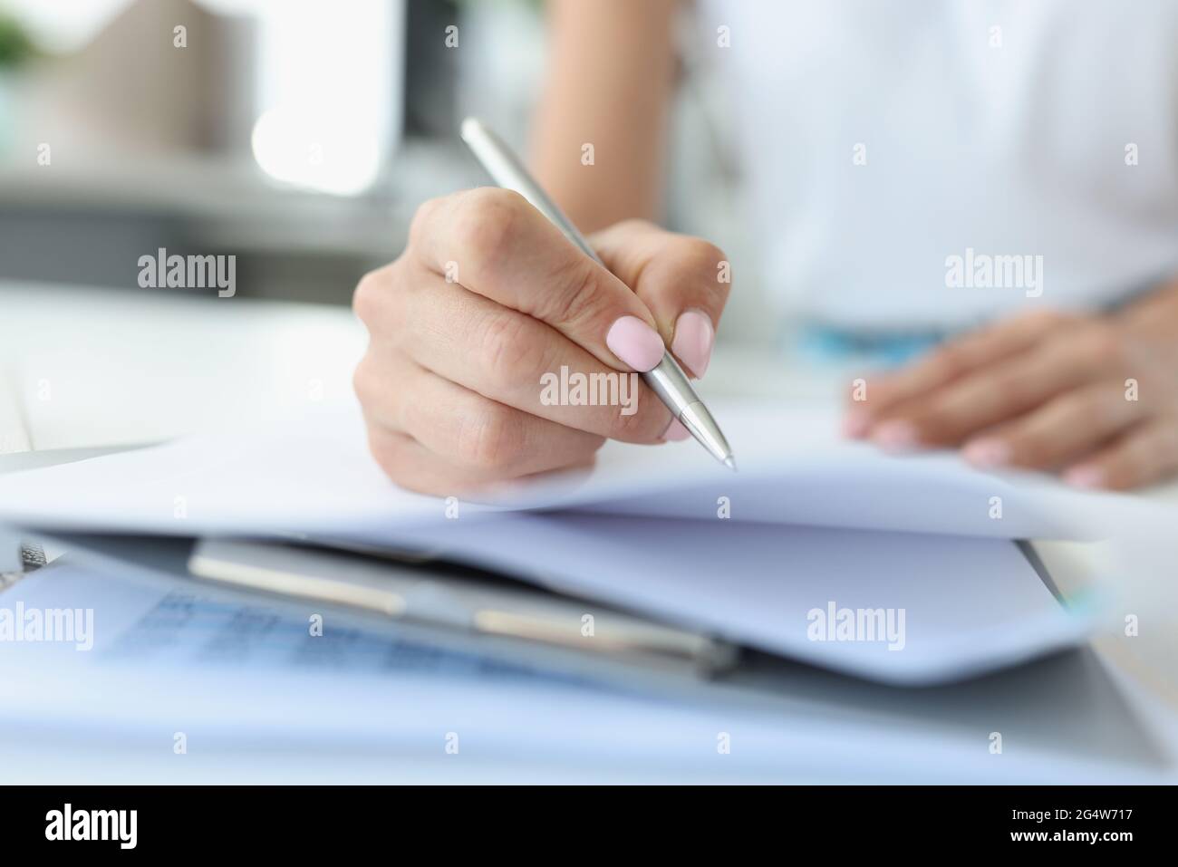 Woman hand makes entries in diary closeup Stock Photo - Alamy