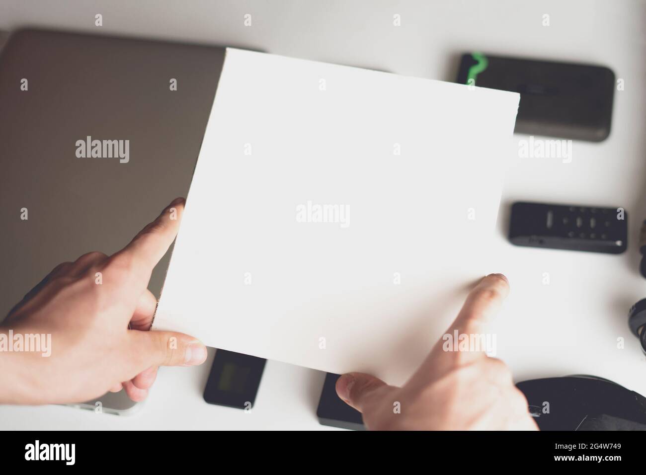 Hand hold white square hi-res stock photography and images - Alamy