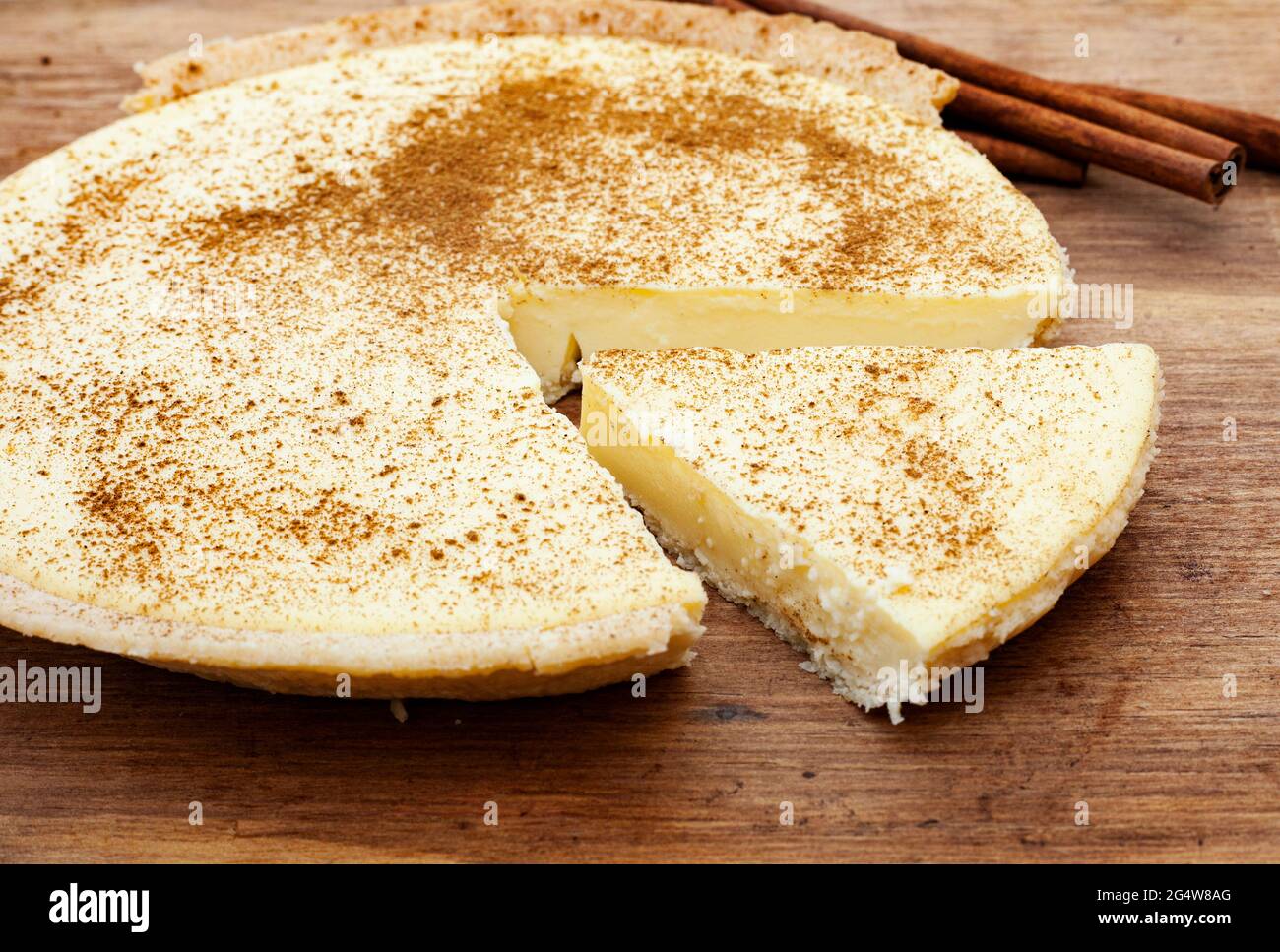 traditional South African milk tart on rustic wooden table Stock Photo ...