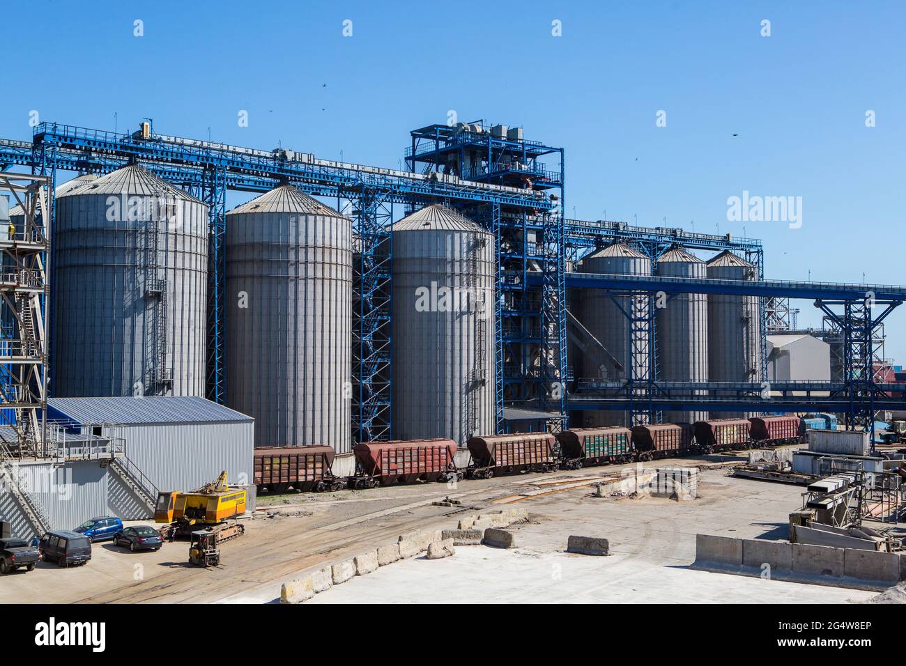 Port grain elevator. Industrial sea trading port bulk cargo zone grain ...