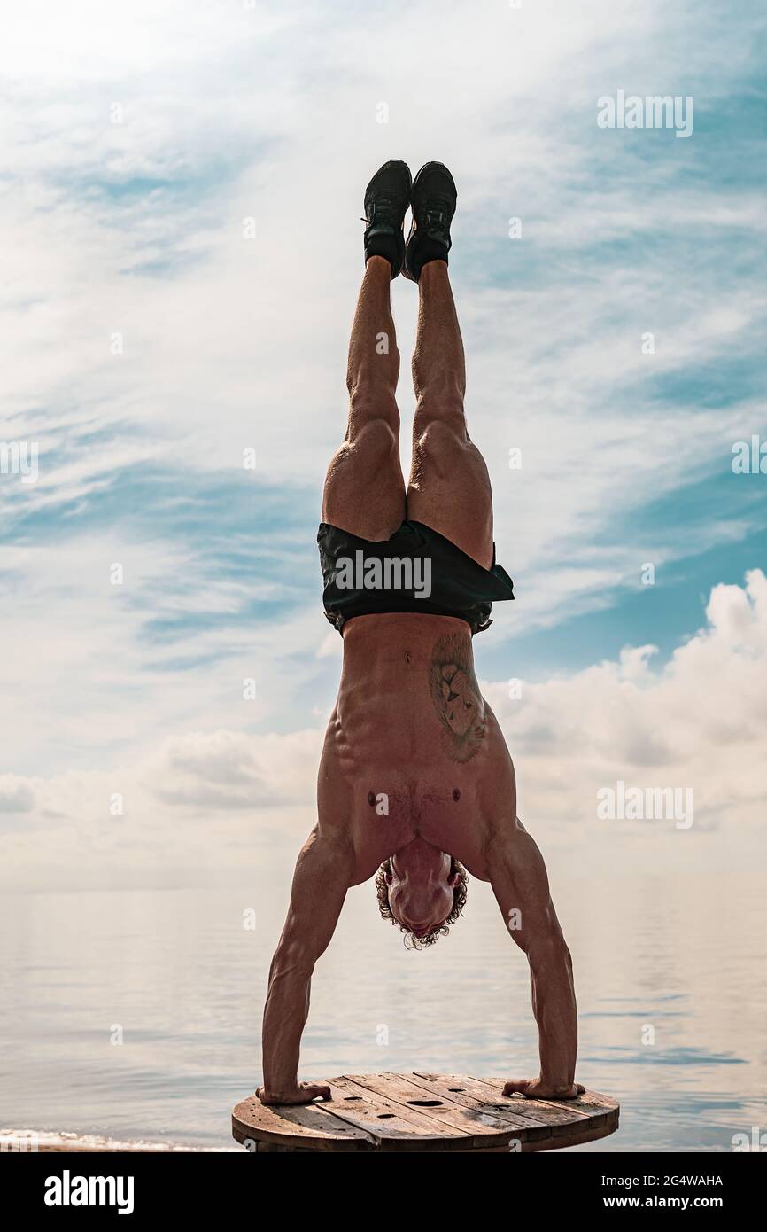Man gymnast doing handstand hi-res stock photography and images - Alamy