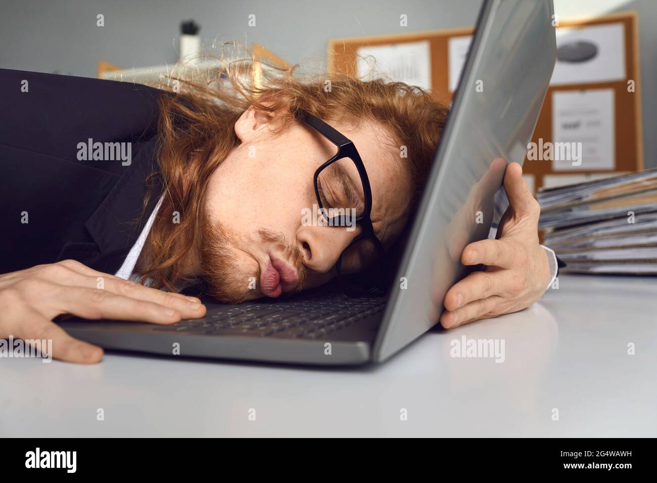 Funny nerdy student or office worker tenderly hugging and kissing his ...