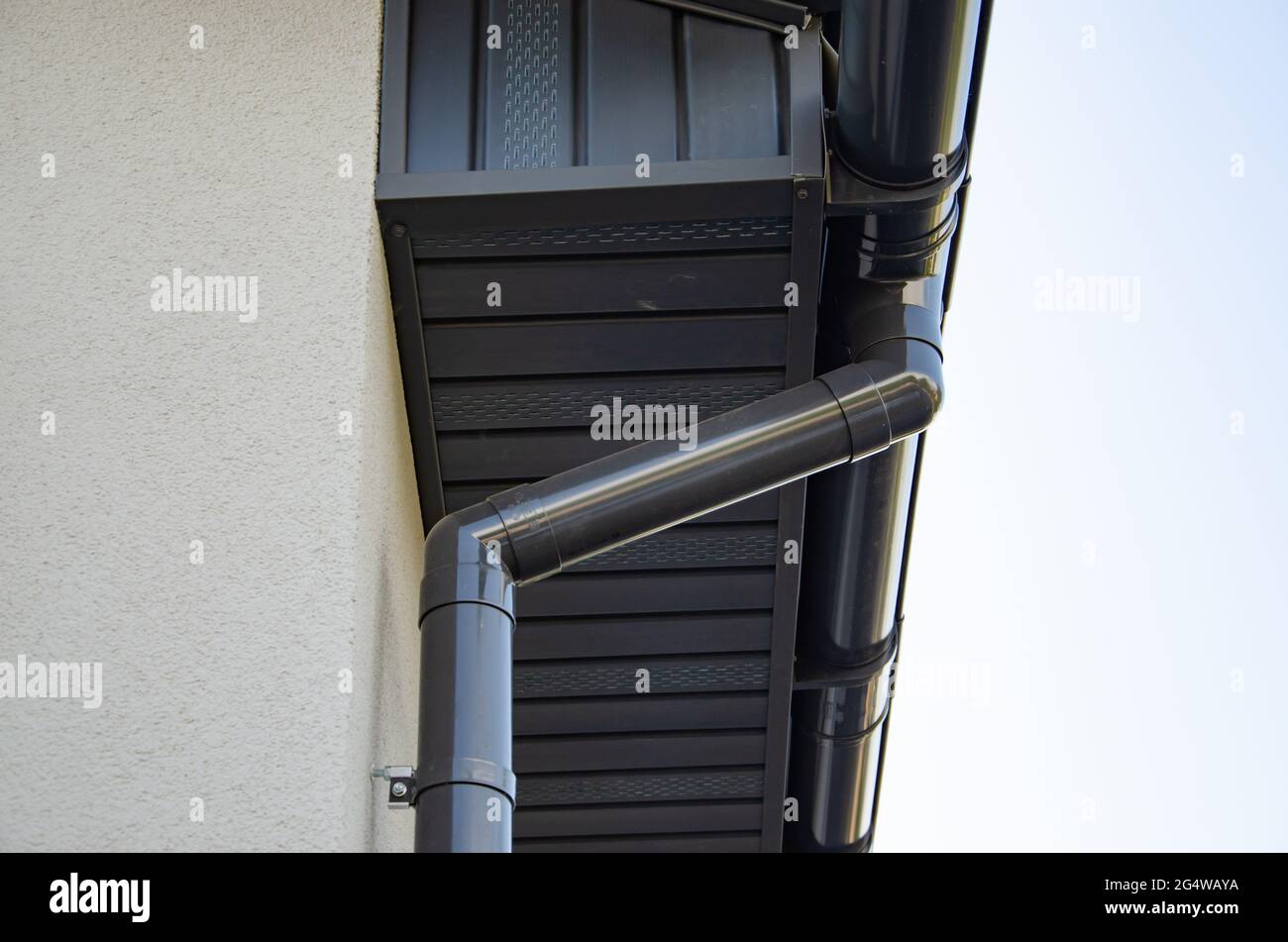 Gutter with downpipe on the roof a house Stock Photo - Alamy