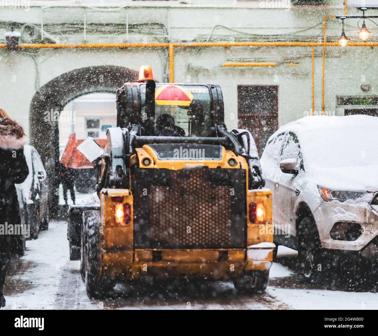 snow cleaning machine work hard in city streets Stock Photo - Alamy