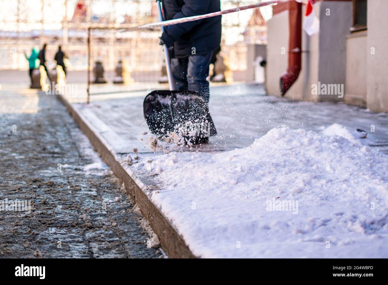 adult man shoveling snow from city streets Stock Photo - Alamy