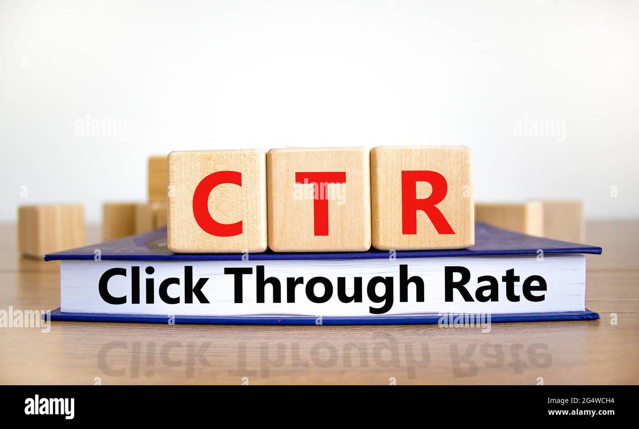 CTR click through rate symbol. Wooden cubes on book with words 'CTR ...