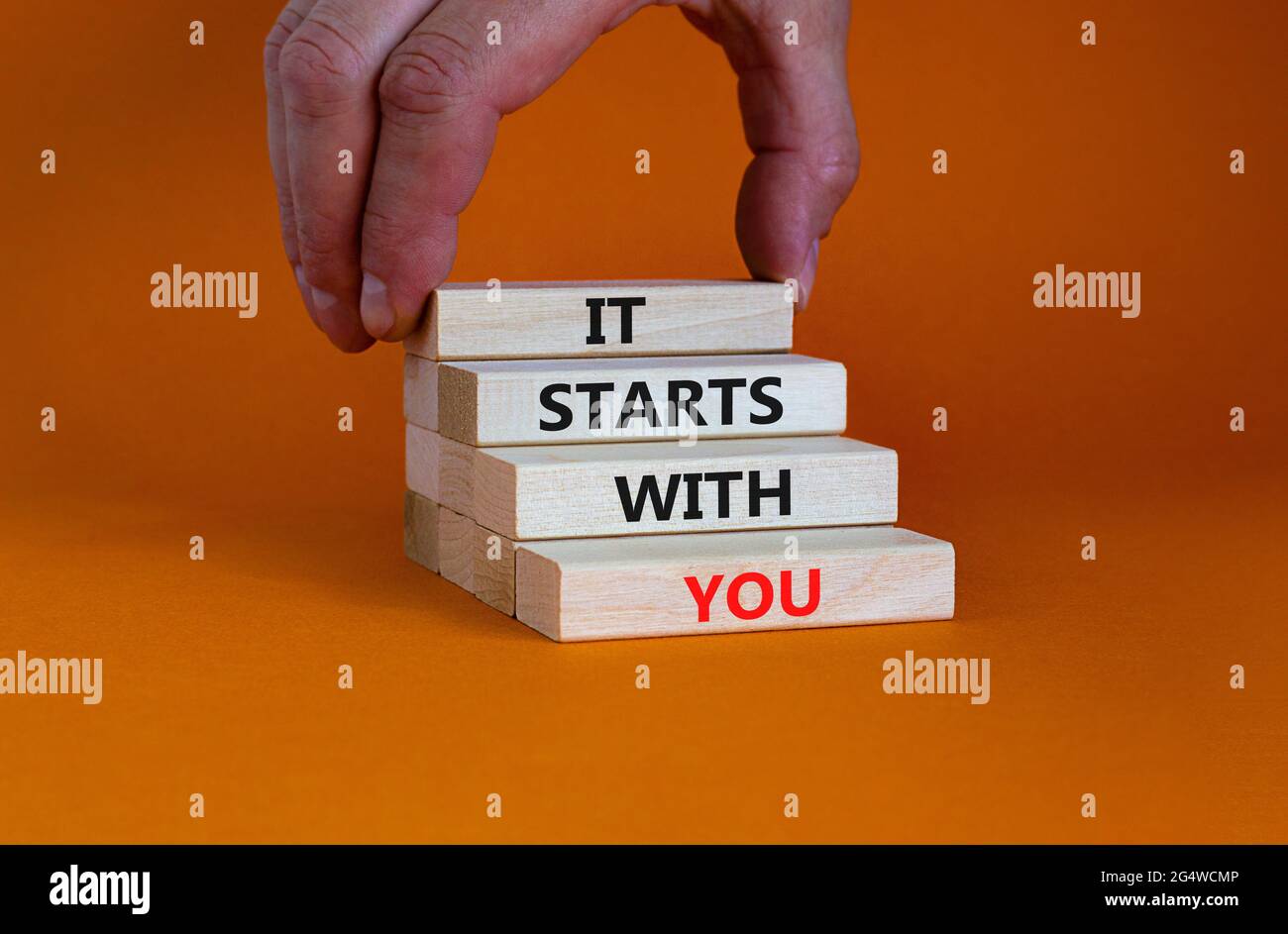 It starts with you symbol. Wooden blocks with words 'it starts with you ...