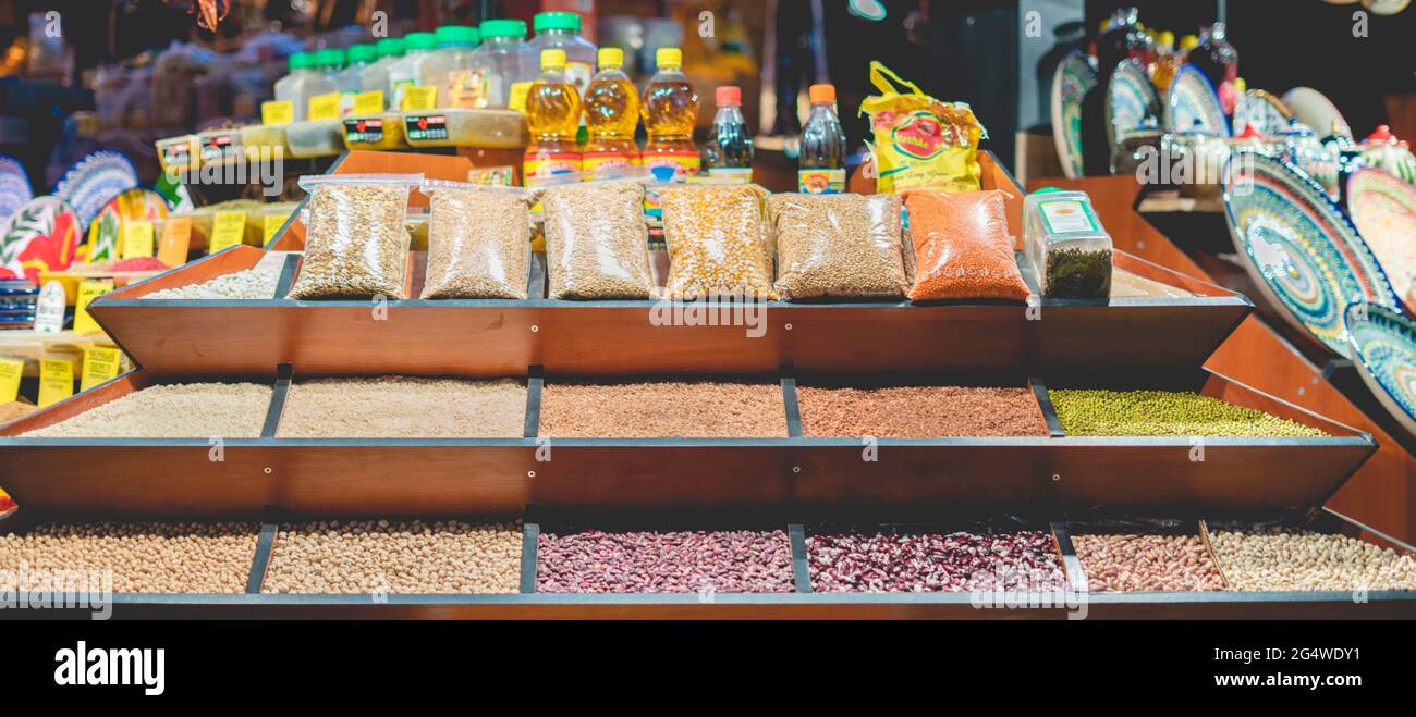 counter with rows of different grains in the market store Stock Photo ...