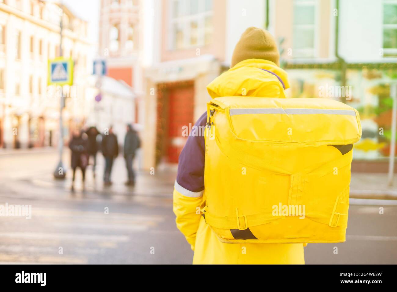 courier delievery guy with huge backpack on foot Stock Photo - Alamy