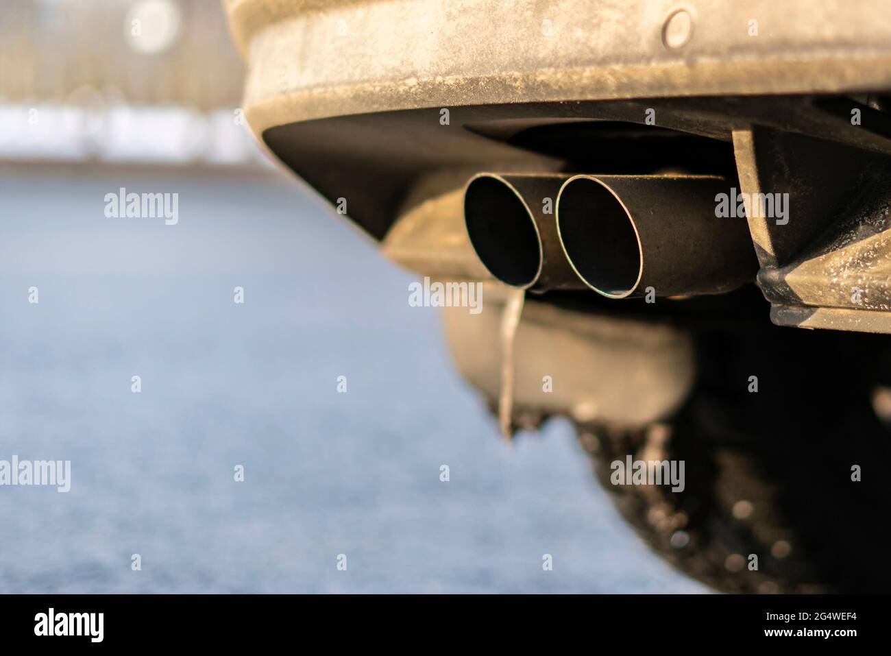 close up exaust pipe of a car releasing gas Stock Photo - Alamy