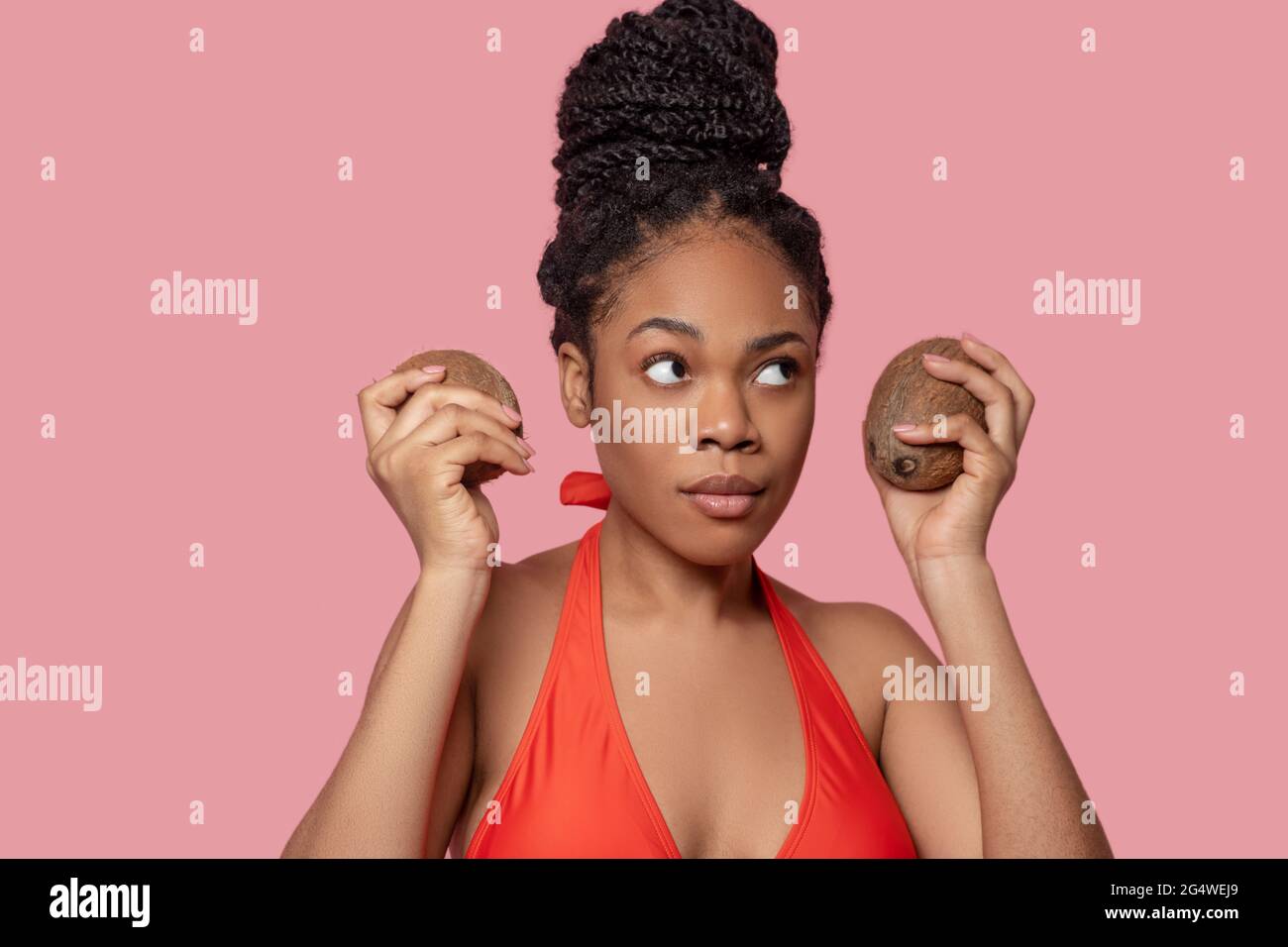 Woman with coconuts hi-res stock photography and images - Alamy