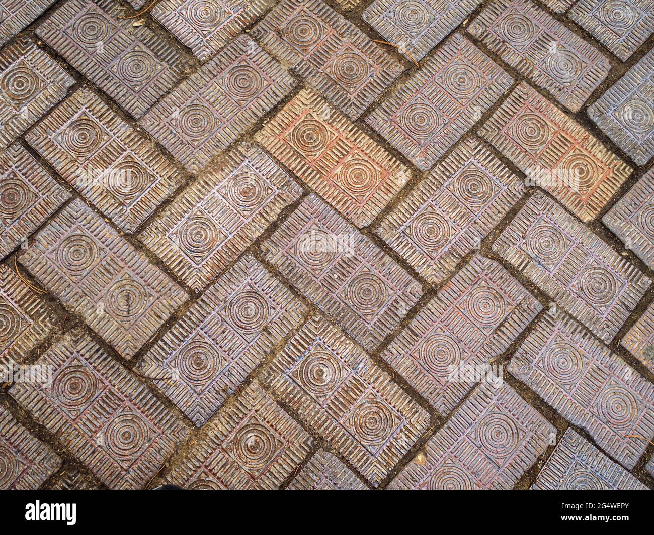 Fancy brick pavers with carved decorative concentric circles and lines ...