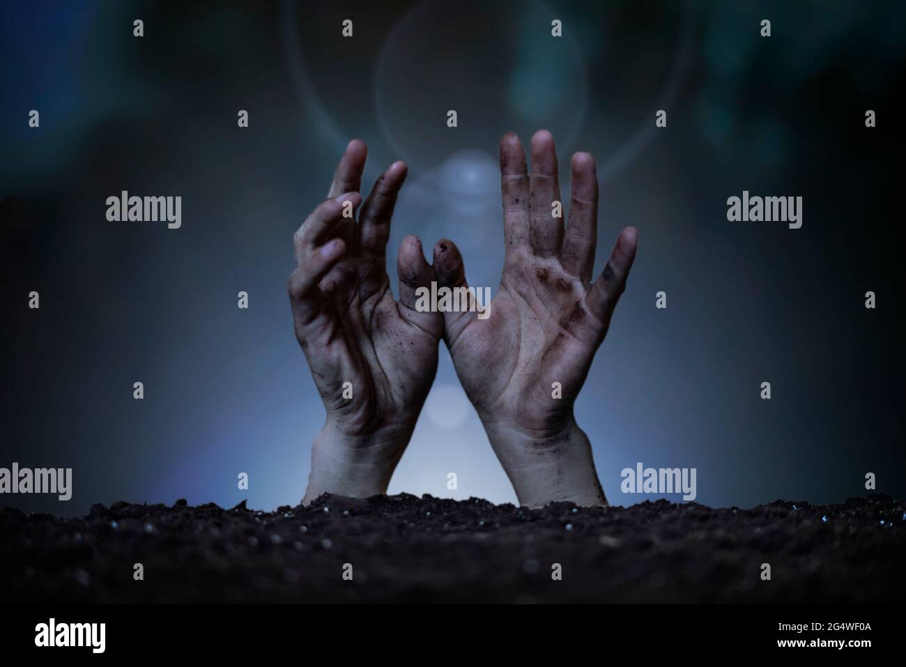 dirty person zombie dead man hand raise from the soil ground, horror ...