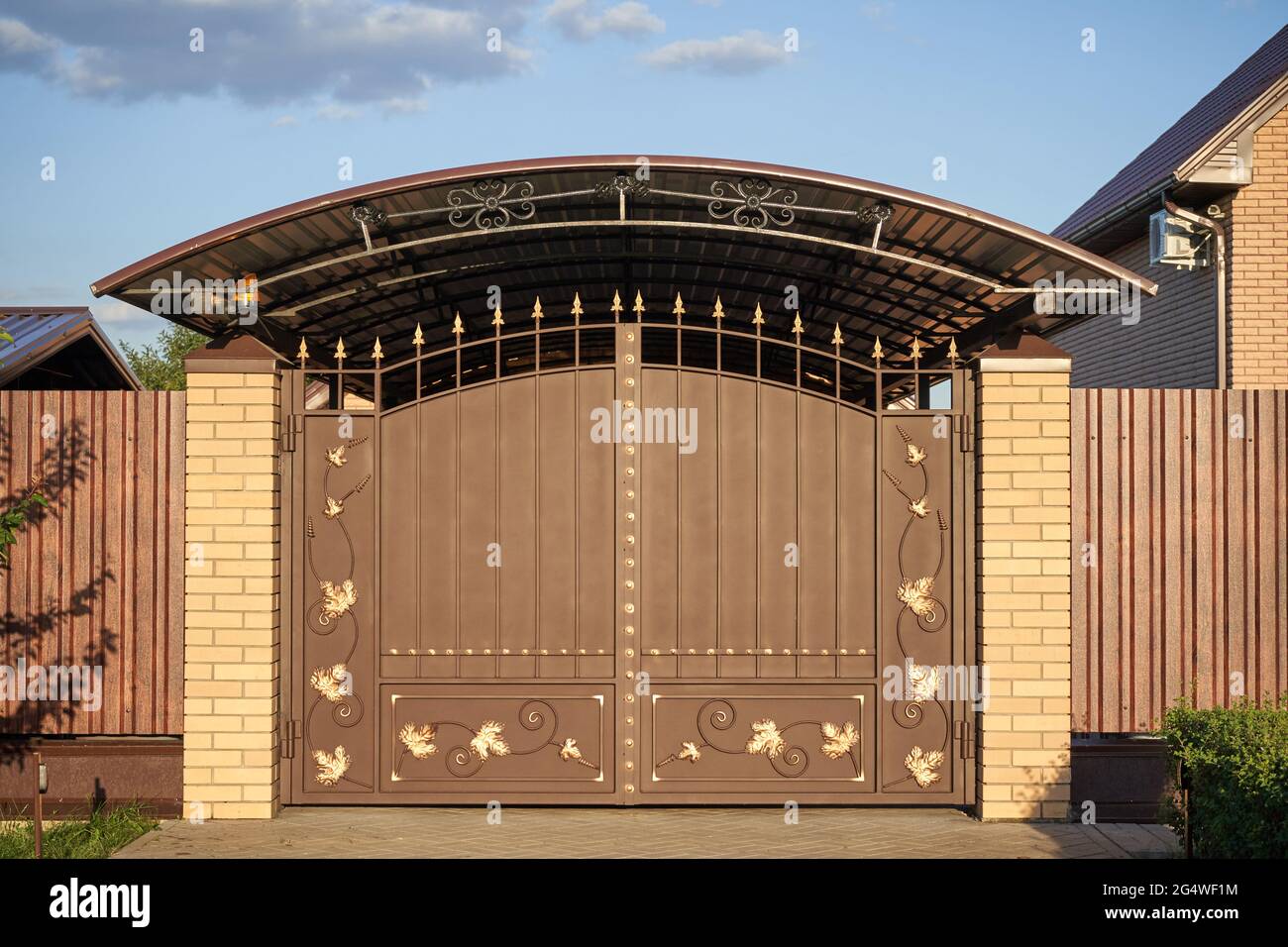 Automatic opening gates and a canopy Stock Photo - Alamy