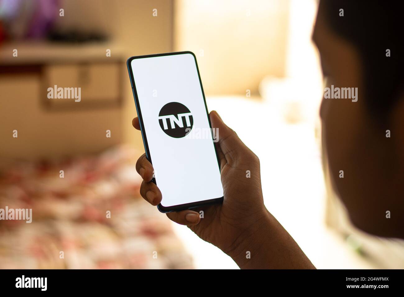 TNT tv logo on phone screen stock image Stock Photo - Alamy