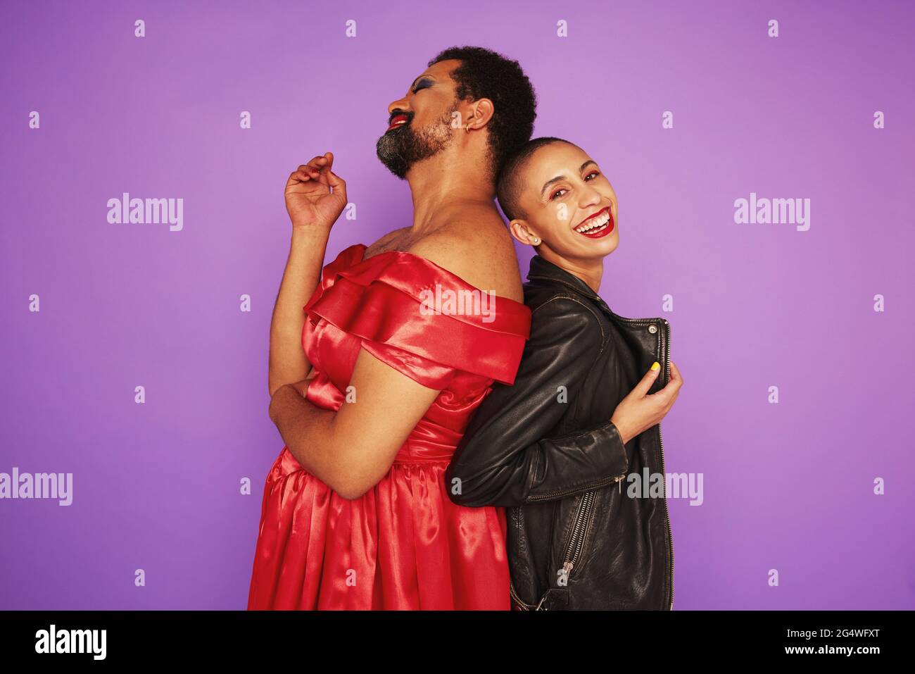 Non conforming couple in stylish outfit. Male and female swopping ...