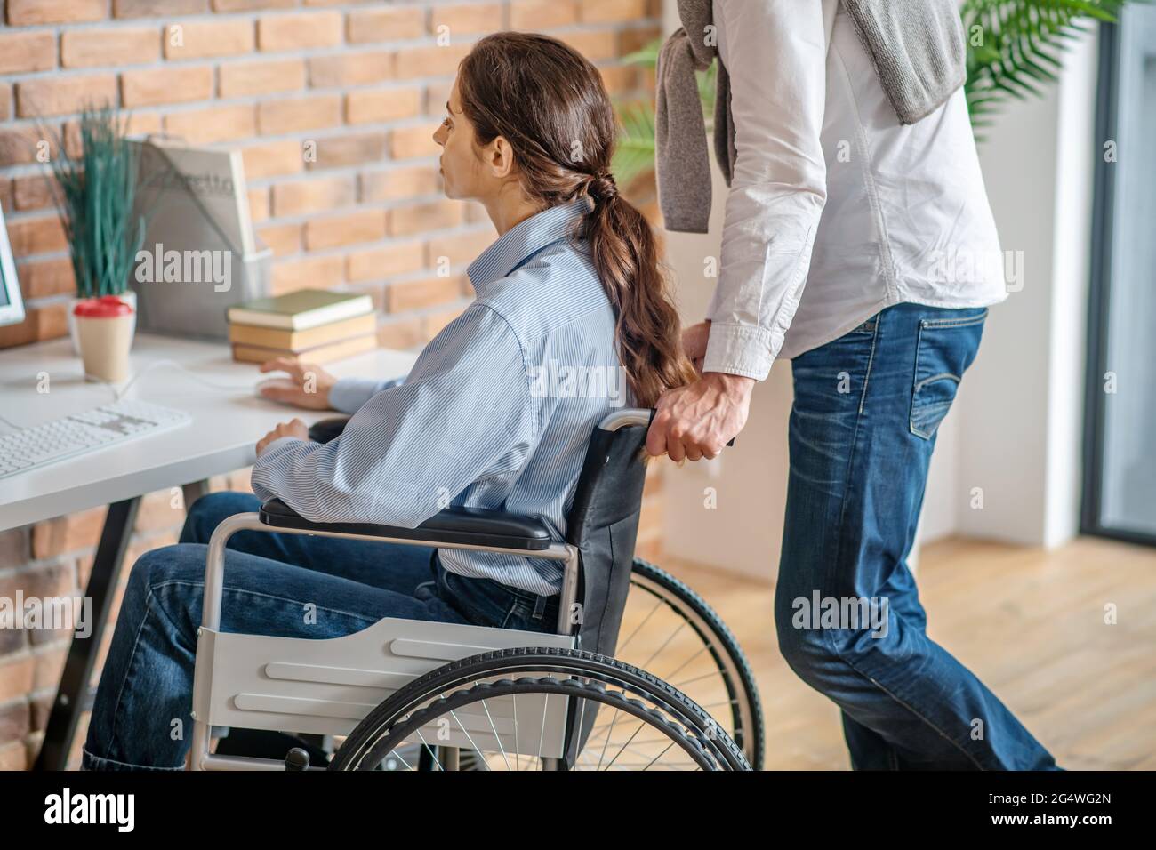 Helping Disabled Young Person High Resolution Stock Photography and ...