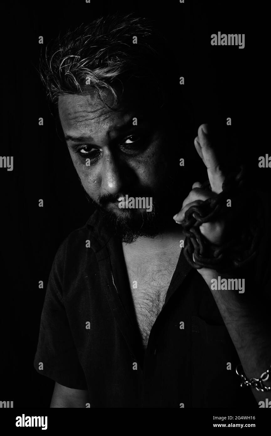 Black and white portrait of a South Asian man posing for a picture ...