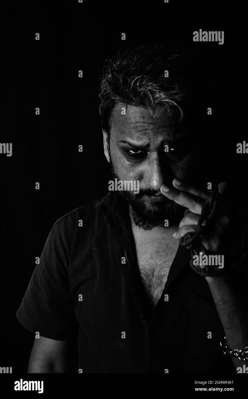 Black and white portrait of a South Asian man posing for a picture ...