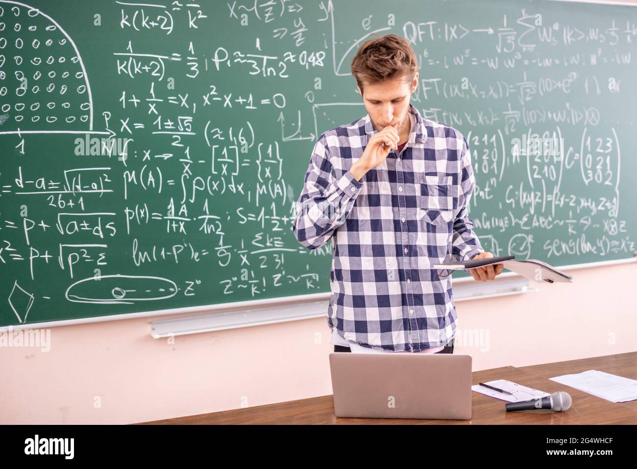 young professor proving theorem on a blackboard Stock Photo - Alamy